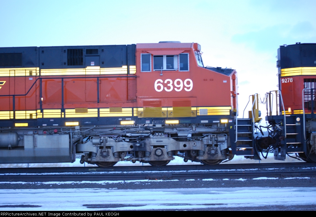 Side shot of BNSF 6399 as she reflects my flash shot off her Swoosh logo.